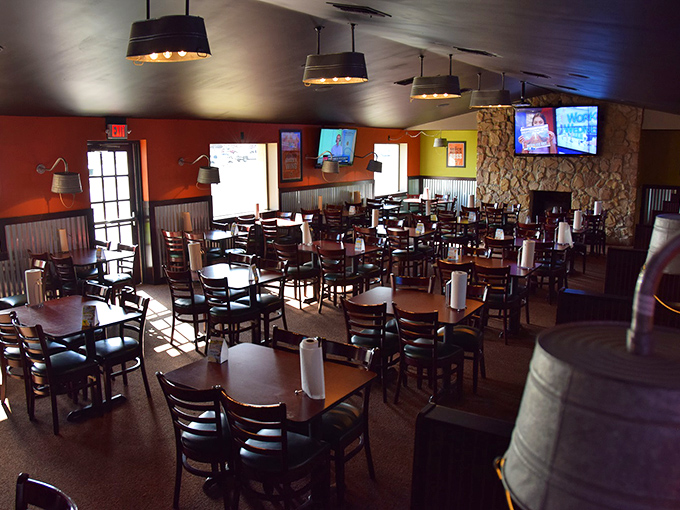The dining room waits for the game day crowd, tables positioned for optimal viewing and optimal sauce-dipping without elbow interference.