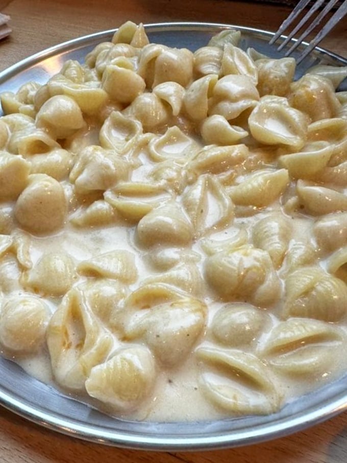 Mac and cheese so creamy, it could make a dairy farmer weep with joy. Comfort food level: Expert.