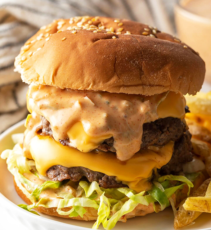 Meet the Mac burger: a tower of temptation that laughs in the face of sensible portion sizes. It's not a meal, it's a dare.