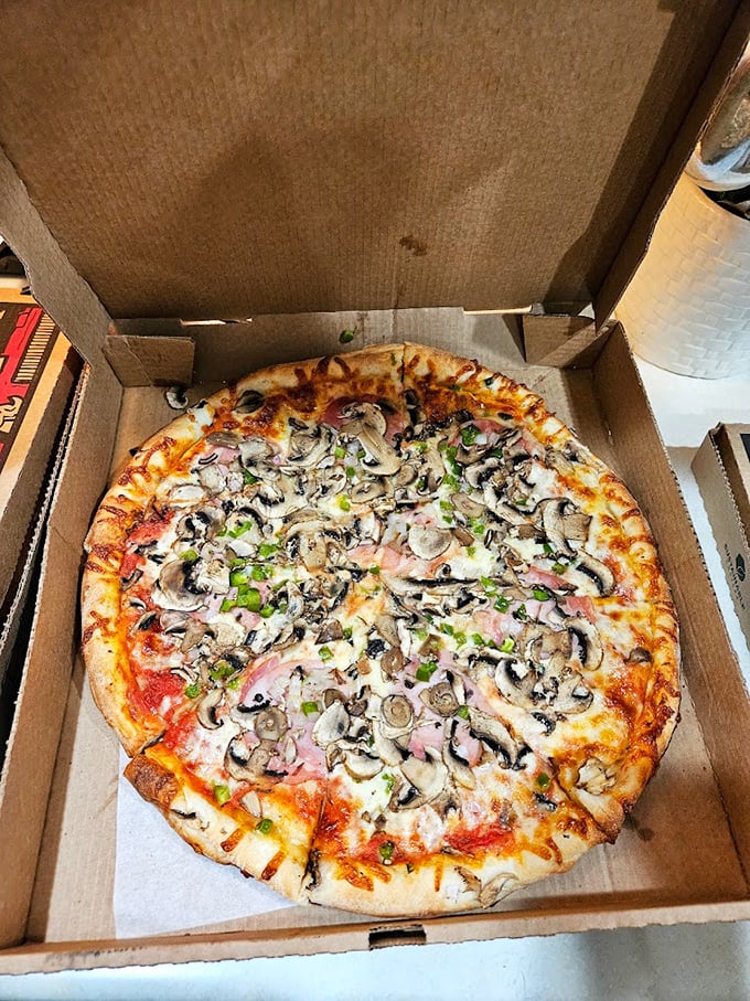 Mushrooms and ham, the Fred Astaire and Ginger Rogers of pizza toppings. They're dancing a savory tango on this pie!
