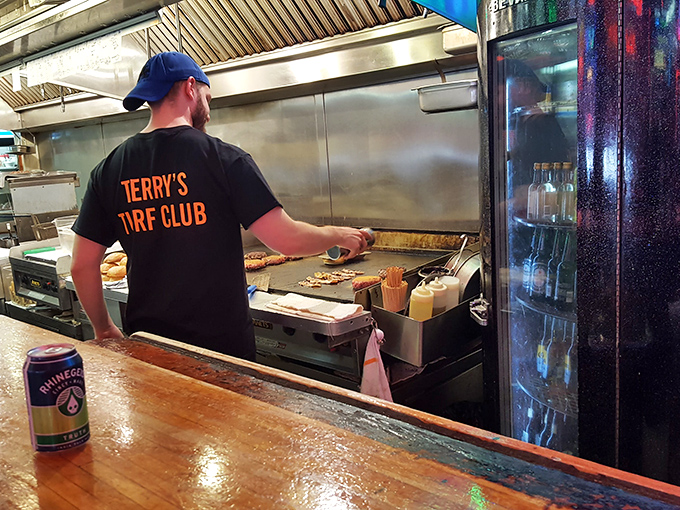 Where the magic happens! The open kitchen at The Turf Club is like a mouthwatering reality show &ndash; come for the food, stay for the culinary drama.