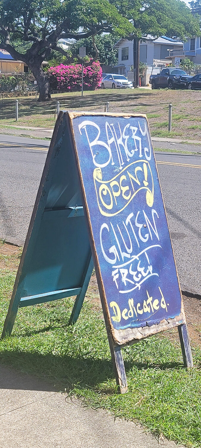 "Bakery Open!" declares this sign, and suddenly the world seems a little brighter. It's like a bat signal for carb lovers.