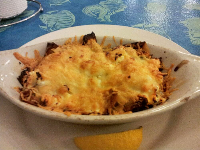 Oysters Rockefeller, the Rolls-Royce of appetizers! This cheesy, bubbly dish is so rich, it should come with its own tax bracket.