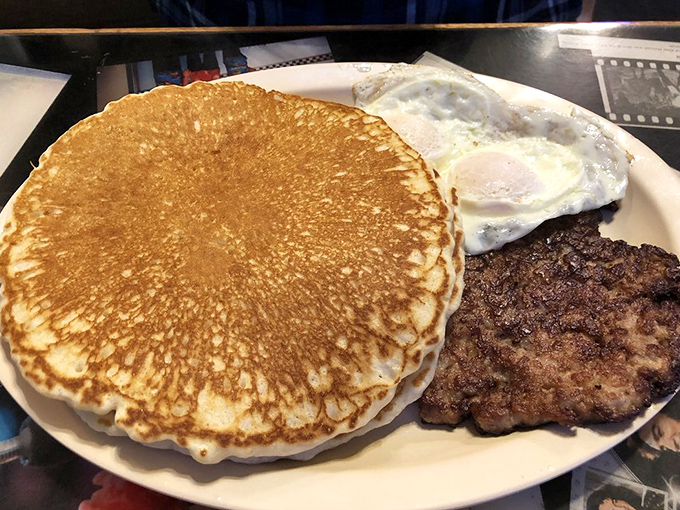 Pancakes so perfectly golden, they'd make King Midas jealous. Paired with eggs and sausage, it's the breakfast trifecta of champions!