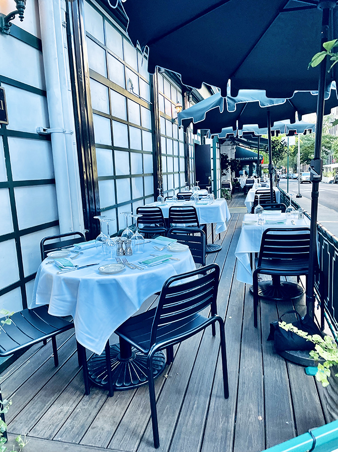 The sidewalk patio: where Manhattan's hustle flows past your table while you remain in the calm eye of the culinary storm.