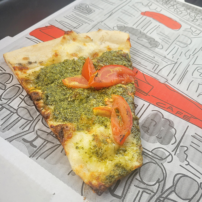 Pesto change-o! This vibrant green slice is like springtime on a plate, bursting with fresh flavors and Italian flair.
