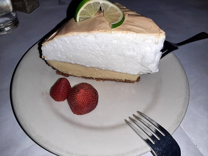 This key lime pie is so high, it might need its own air traffic control. Talk about a slice of heaven!