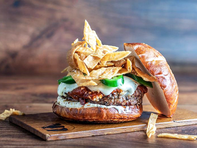 The Plague Burger: A tower of temptation! This sky-high creation is stacked with flavors that'll have your taste buds dancing.