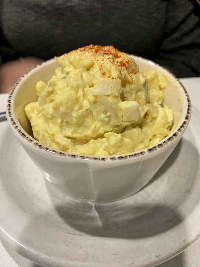 Spud-tacular side dish alert! This potato salad looks creamier than a 1950s crooner's voice and twice as satisfying.