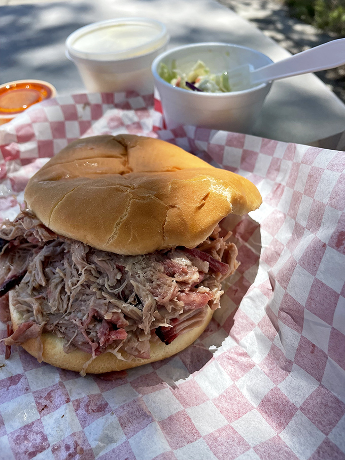 This pulled pork sandwich isn't messing around&mdash;it's a serious stack of smoke-kissed pork that requires both hands and possibly a nap afterward.