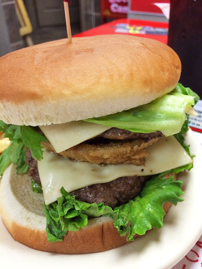 The Samasaurus isn't just named after dinosaurs&mdash;it's sized for them. Layers of patty, cheese, veggies, and bacon create edible architecture.