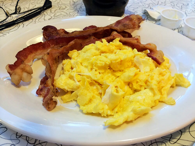 Eggs so fluffy they could float away, bacon so crispy it could star in its own ASMR video. Breakfast of champions, indeed!