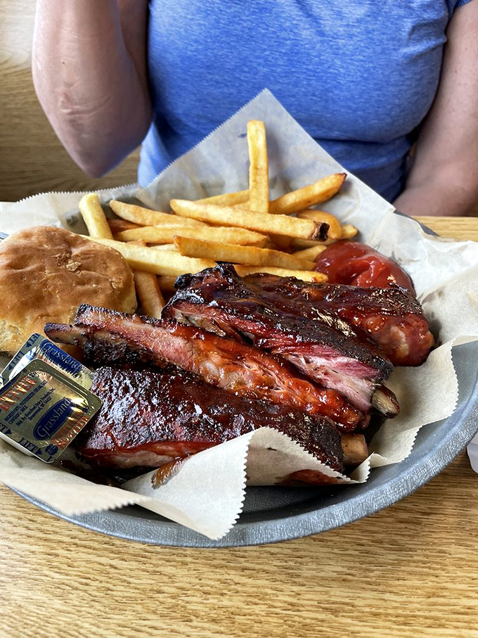 Ribs that'll make you forget your table manners. Paired with crispy fries, it's a plate that says, "Diet? What diet?" in the most delicious way possible.