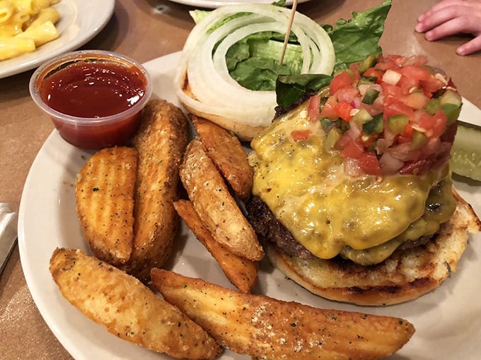 This isn't just a burger&mdash;it's a towering achievement of beef, cheese, and fresh pico de gallo that requires both hands and a strategic approach.