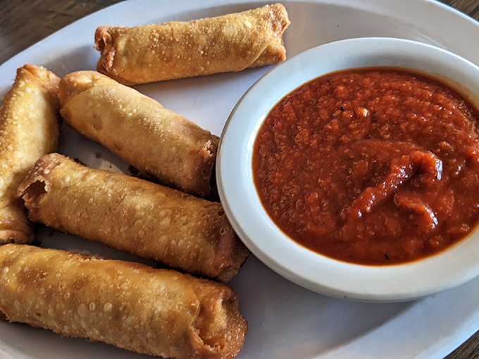 These golden-fried spring rolls with marinara showcase the Italian roots behind this American institution. Crispy outside, molten inside.