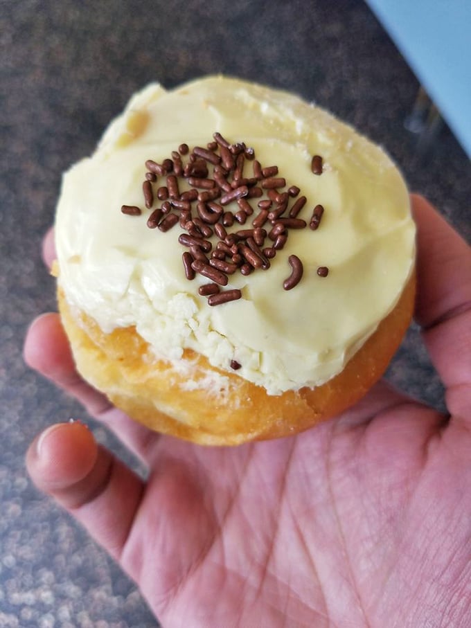 Pretty in pink and oh-so-sweet! This strawberry banana cream donut is like a tropical vacation for your mouth, no passport required.