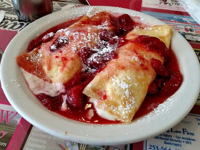 Strawberry cheese blintzes: Dessert masquerading as breakfast. Your sweet tooth called, it wants to move in permanently.