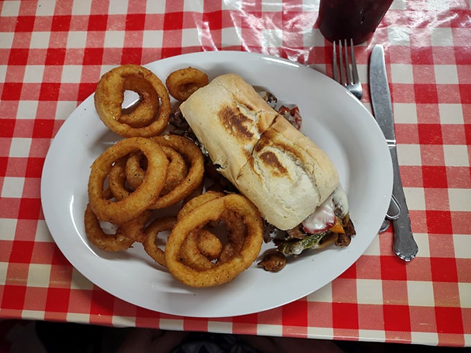 A proper diner sandwich served with golden onion rings&mdash;the kind of lunch that makes you wonder why anyone would ever choose a salad.