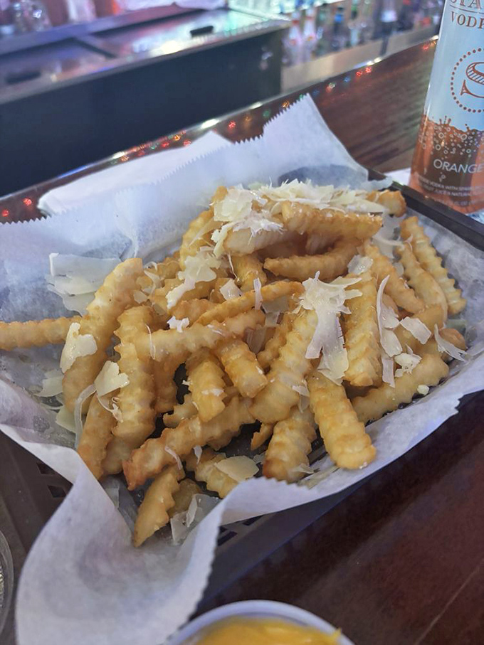 Fries dusted with parmesan&mdash;the supporting actor that sometimes steals the scene. Crispy, salty perfection that demands to be shared.