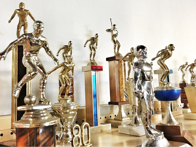 Trophy case treasures! Someone's forgotten tournament victories become conversation pieces for your bookshelf or ironic office awards.