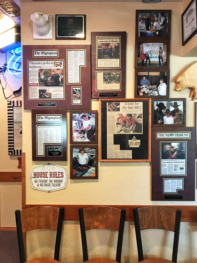 A wall of fame that tells the story of barbecue glory. Each frame is a chapter in the smoky saga.