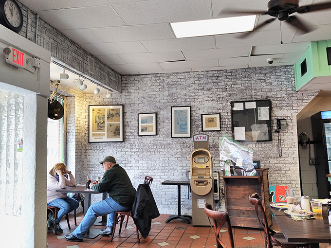 The walls are a visual buffet of local history and quirky charm. It's like Instagram, but with actual photographs and zero filters.