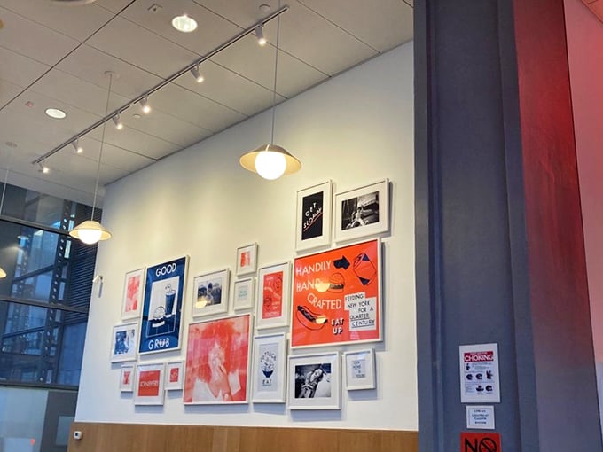 The wall art gallery creates a modern diner vibe that says, "Yes, we take comfort food seriously enough to give it a proper backdrop."