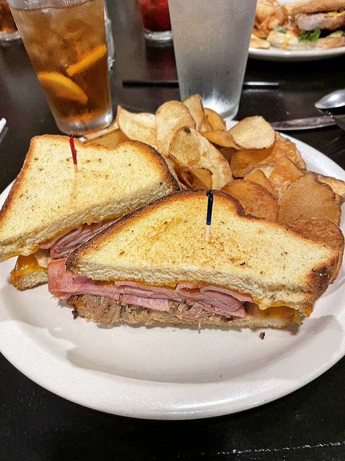 The "Wild Hog" sandwich: a tower of temptation. Layers of meat and melty cheese between golden toast. Napkins required!