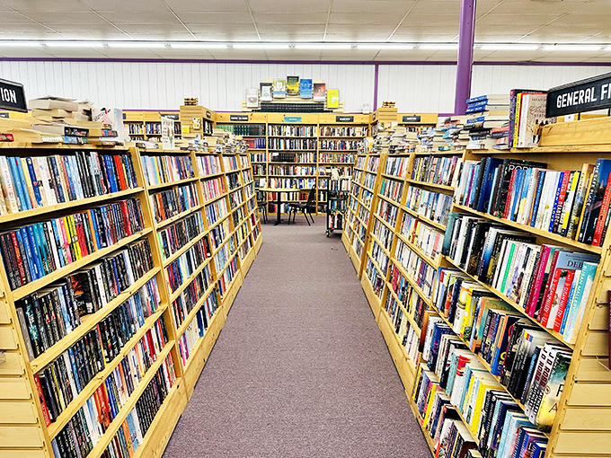 Straight out of a bookworm's dream! This aisle seems to stretch into infinity, a yellow brick road of literary delights.