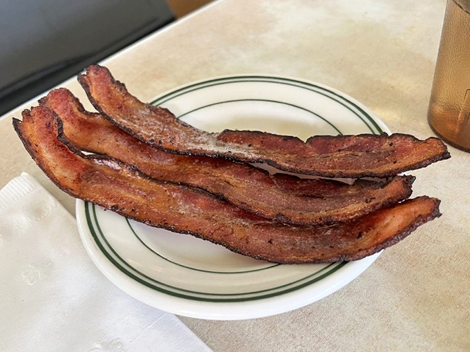 Bacon: nature's candy for grown-ups. These crispy strips are the reason alarm clocks were invented.