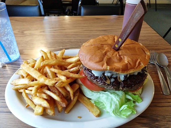 This isn't just a burger, it's a tower of power. Topped with enough cheese to make Wisconsin jealous.
