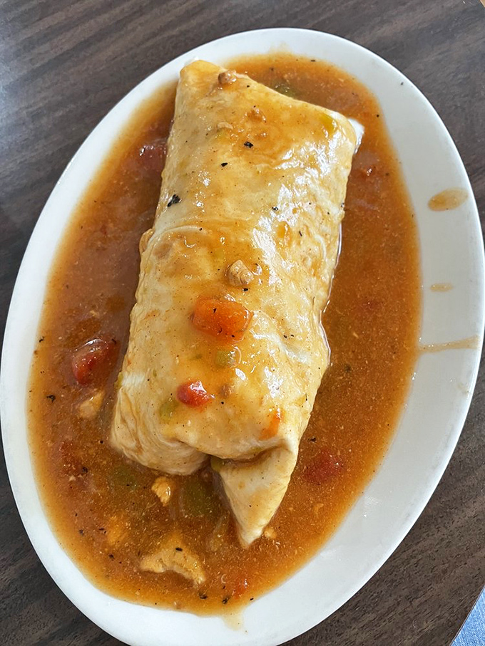 Burrito or life raft? This sauce-drenched beauty could save you from a sea of hunger. Dive in and don't come up for air!