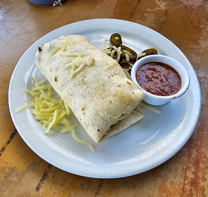 Burrito bonanza! This hefty wrap is packed tighter than a tourist's suitcase, ready to fuel your island adventures.