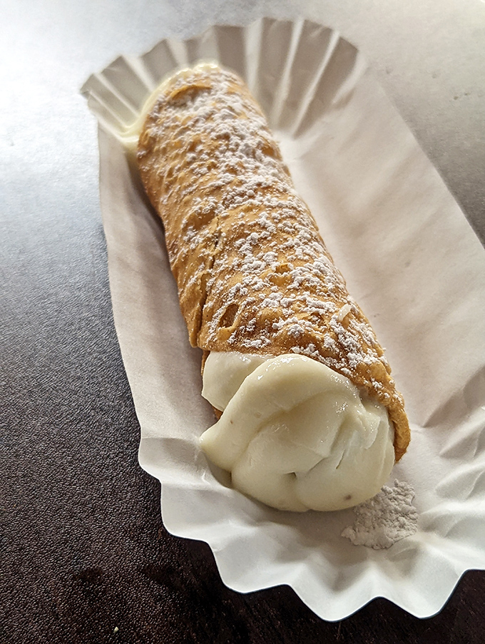 Sweet endings! Zuppardi's cannoli is the perfect finale to your pizza adventure, crispy, creamy, and utterly irresistible.