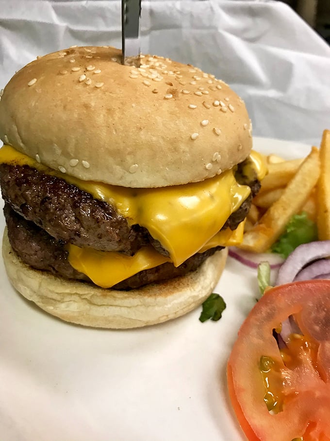 Meet the cheeseburger that puts all others to shame. This isn't fast food; it's a slow dance of flavors that'll make your taste buds swoon.