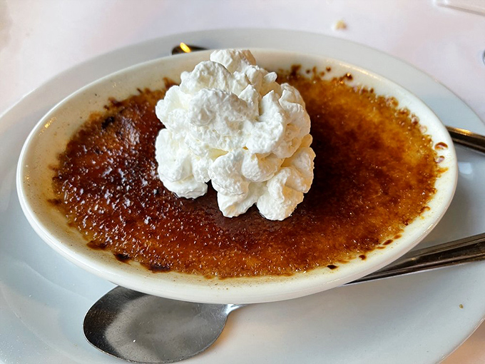 Cr&egrave;me br&ucirc;l&eacute;e so perfectly torched, it could moonlight as a welder. Crack that sugar and dive in!