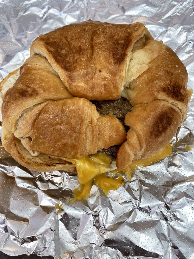Breakfast of champions! This croissant sandwich is ready to tackle your hunger like a linebacker at the Horseshoe. Who says you can't have it all?