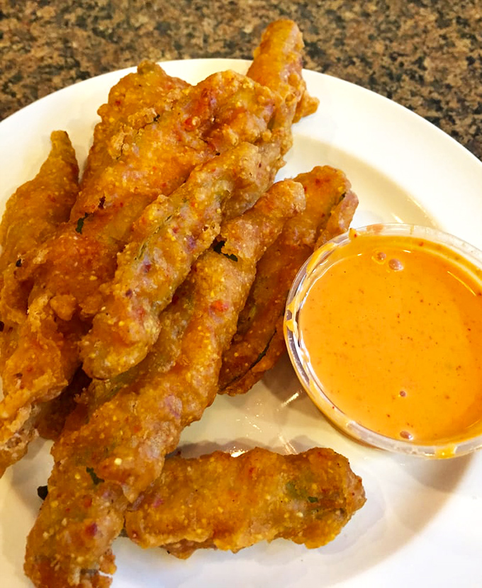 Fried okra: the South's crunchy little secret. It's like popcorn's cooler, more flavorful cousin.