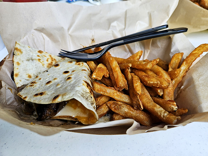 Wrapped up and ready for adventure! This hearty wrap and crispy fries combo is the fuel you need for cave exploration.