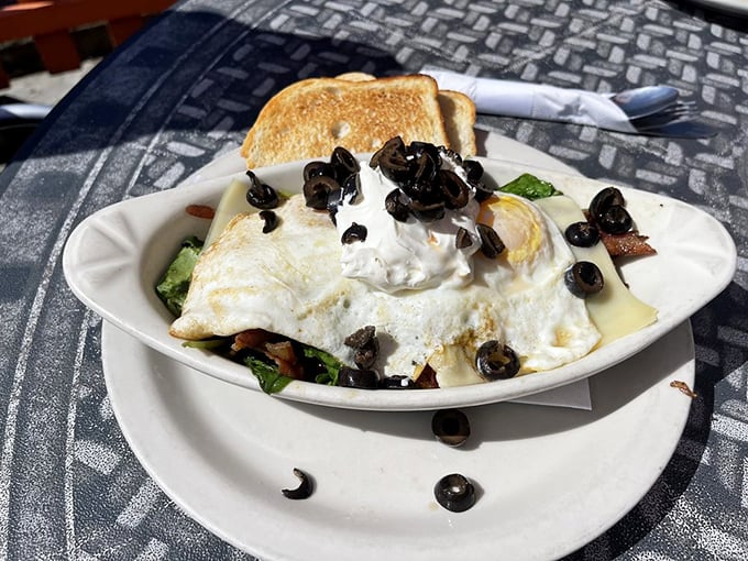 Is it an omelet? A work of modern art? Whatever it is, it's smothered in deliciousness and begging to be devoured.