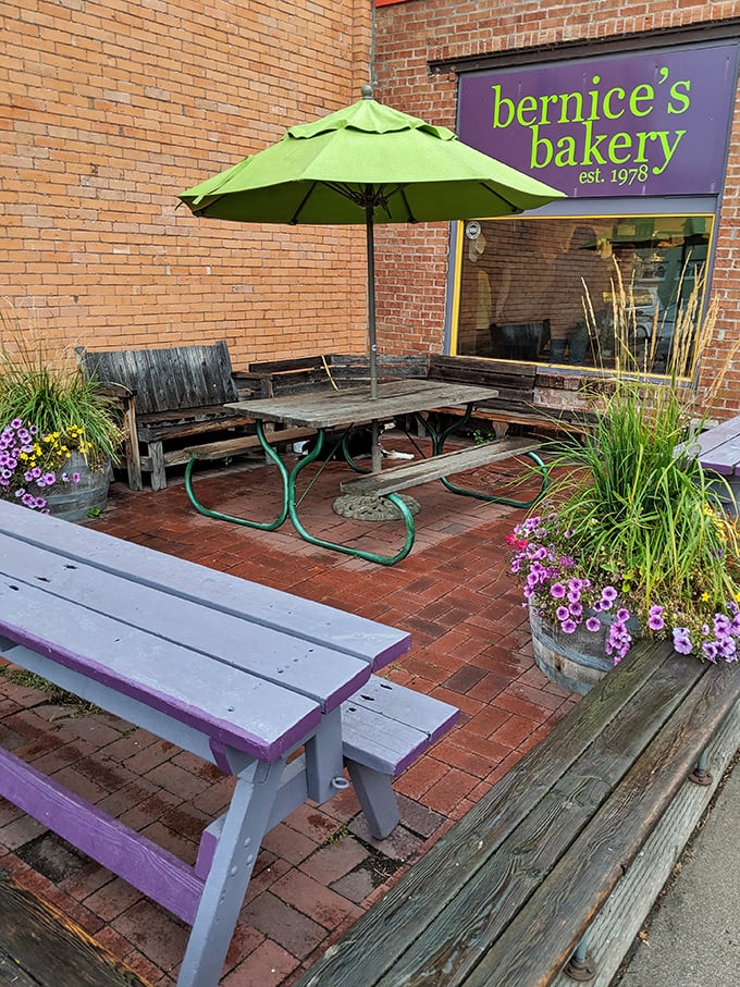 The outdoor patio, complete with purple benches and potted flowers, offers a slice of Montana charm.