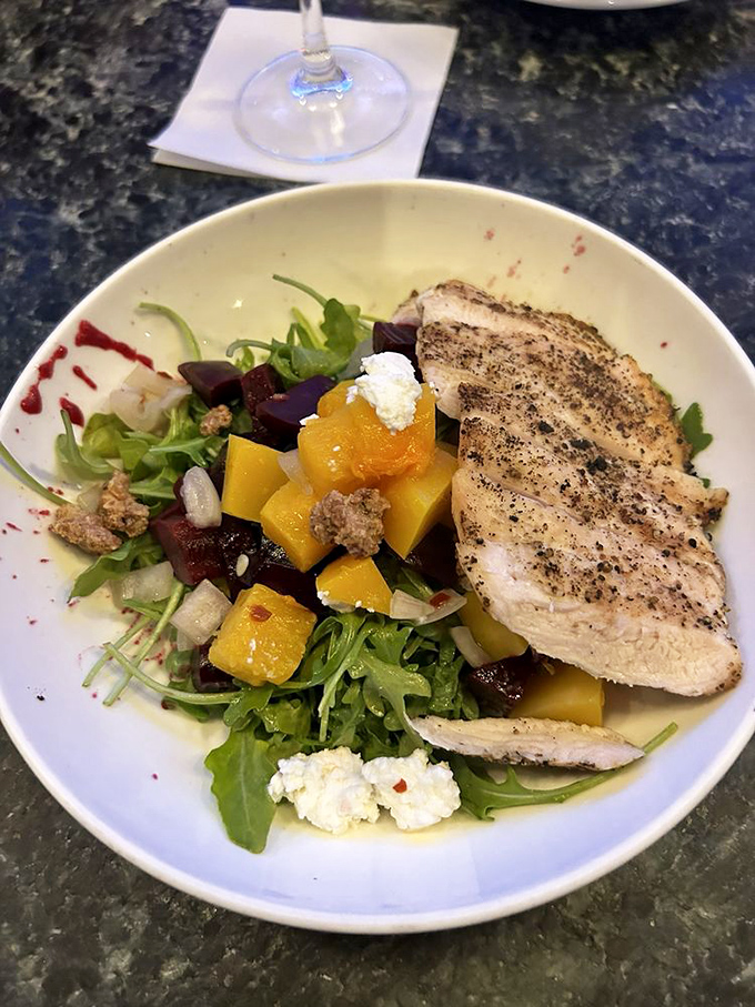 This isn't just a salad; it's what happens when island produce meets thoughtful preparation &ndash; a colorful counterpoint to all that glorious cheese.