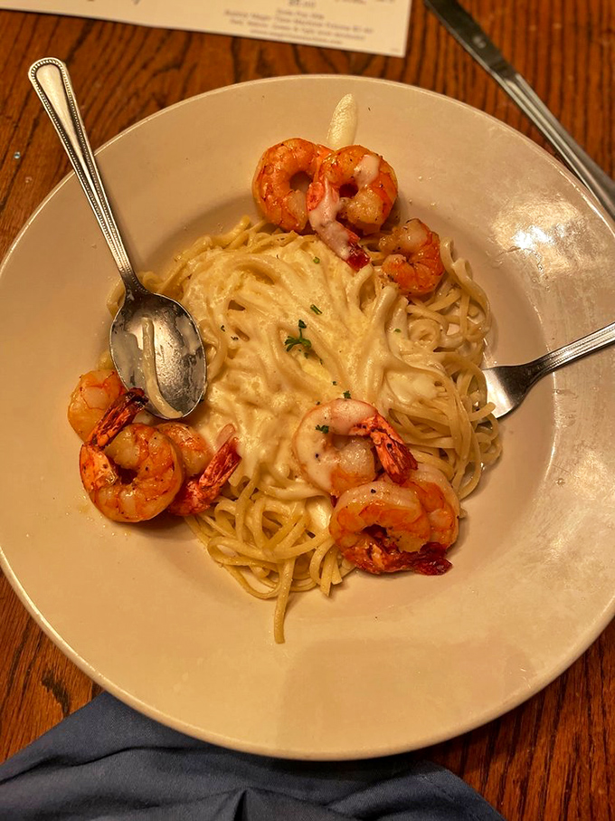 Shrimp Alfredo that's creamier than a 1950s milkshake. These plump crustaceans are taking a luxurious pasta bath.
