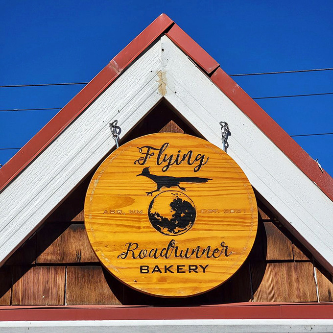 A sign from above! This wooden emblem is like a beacon of hope for carb lovers, guiding them to their sugary sanctuary.