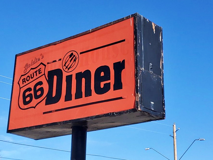 The bat signal for hungry travelers! This sign is like a lighthouse for empty stomachs, guiding weary road-trippers to delicious salvation.