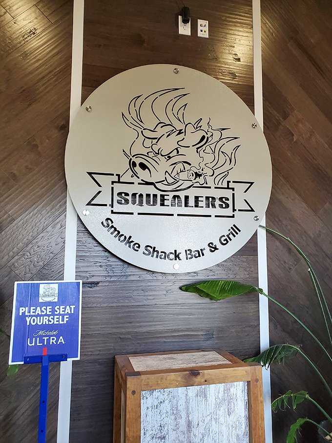 Oink if you love BBQ! Squealer's logo is like a bat signal for meat lovers, calling all to gather for a feast of epic proportions.