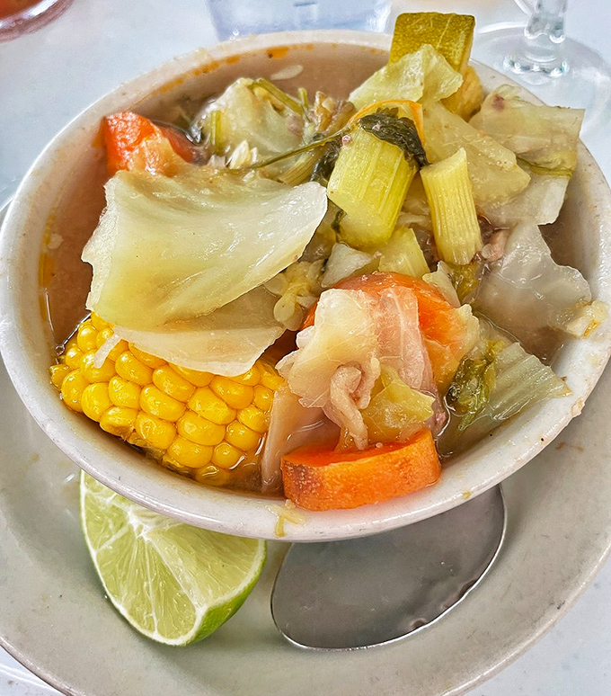 Soup for the soul? More like soup for the fiesta! This bowl of goodness is packed with more colors than a tie-dye shirt convention.