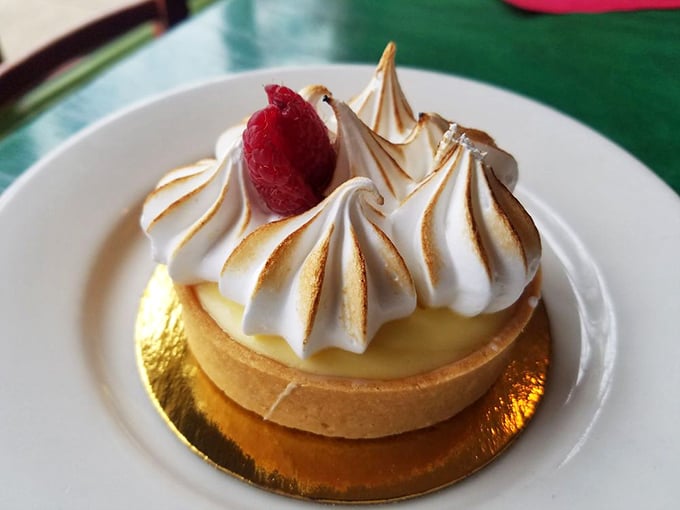 Lemon tart with a twist of whimsy. It's sunshine on a plate, topped with clouds so light they might just float away. Quick, catch them with your fork!
