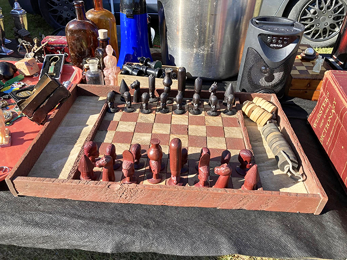 Hand-carved chess pieces stand at attention on a well-loved board. Each dent and scratch represents a strategic battle from decades past.