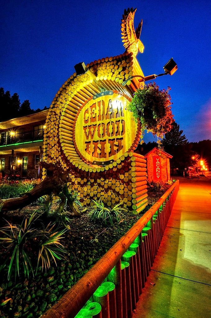 The Cedar Wood Inn sign: Deadwood's nightlight, guiding weary travelers and night owls alike. It's Vegas meets Grizzly Adams, with a dash of neon charm.
